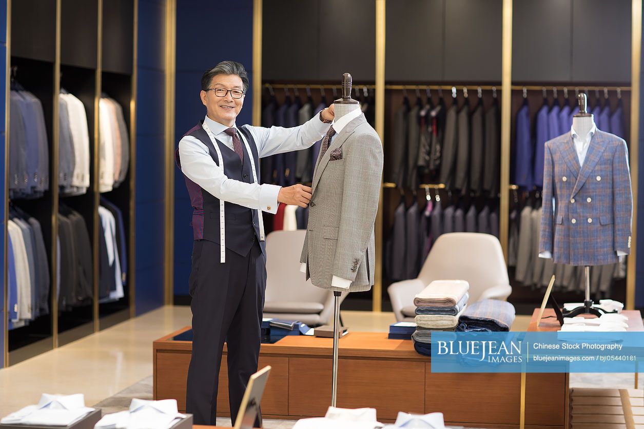 Confident Chinese fashion designer working-High-res stock photo for ...