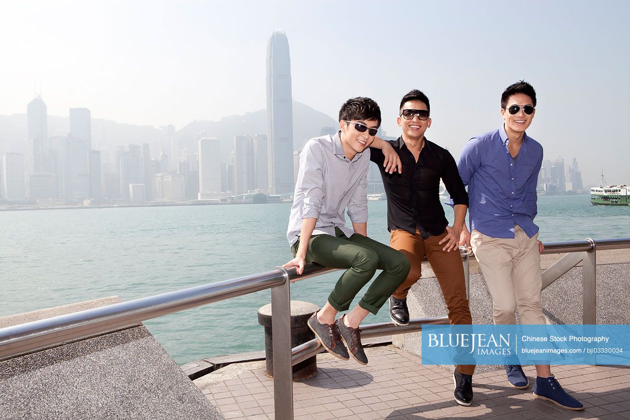 Fashionable young Chinese men enjoying the beautiful moment in Victoria ...