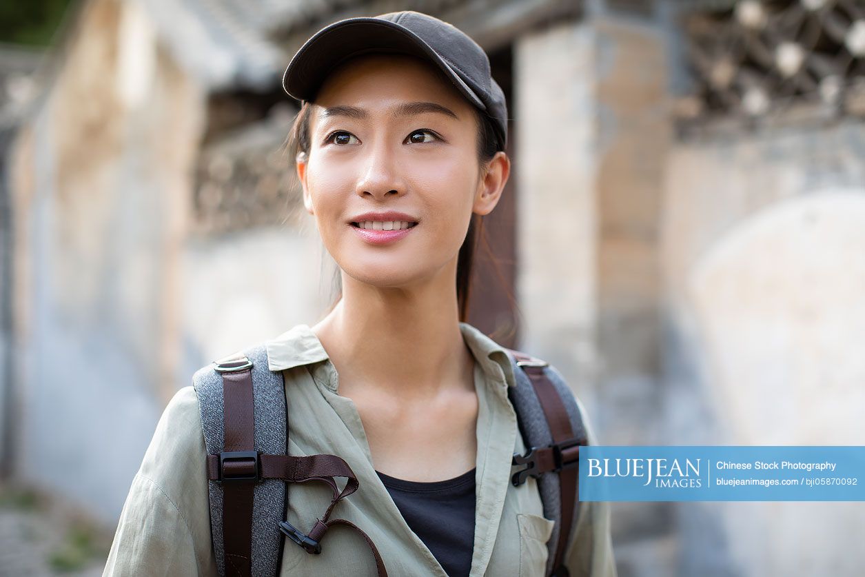 Young Chinese woman hiking outdoors-High-res stock photo for download