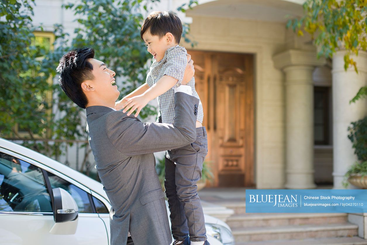 Chinese father playing with his son-High-res stock photo for download