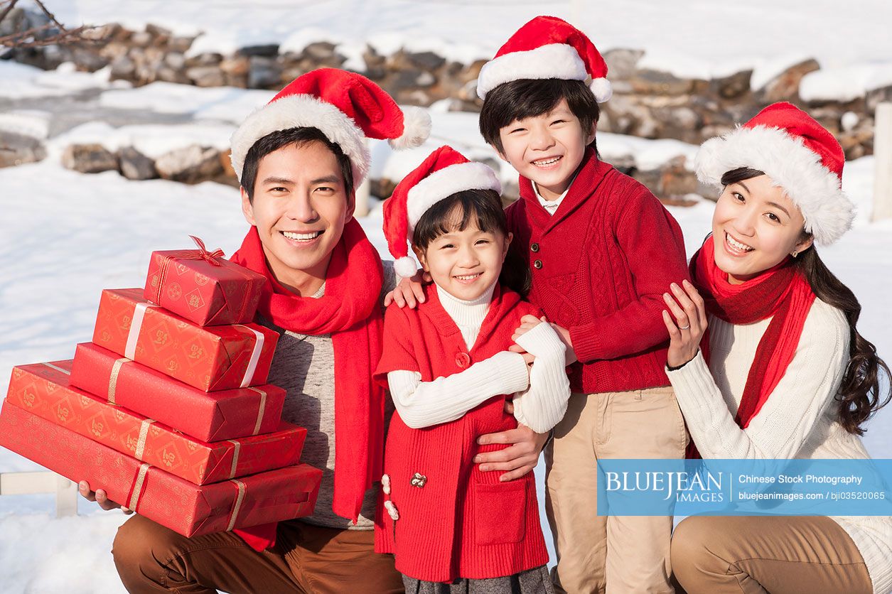 Cheerful Chinese family celebrating Christmas-High-res stock photo for ...