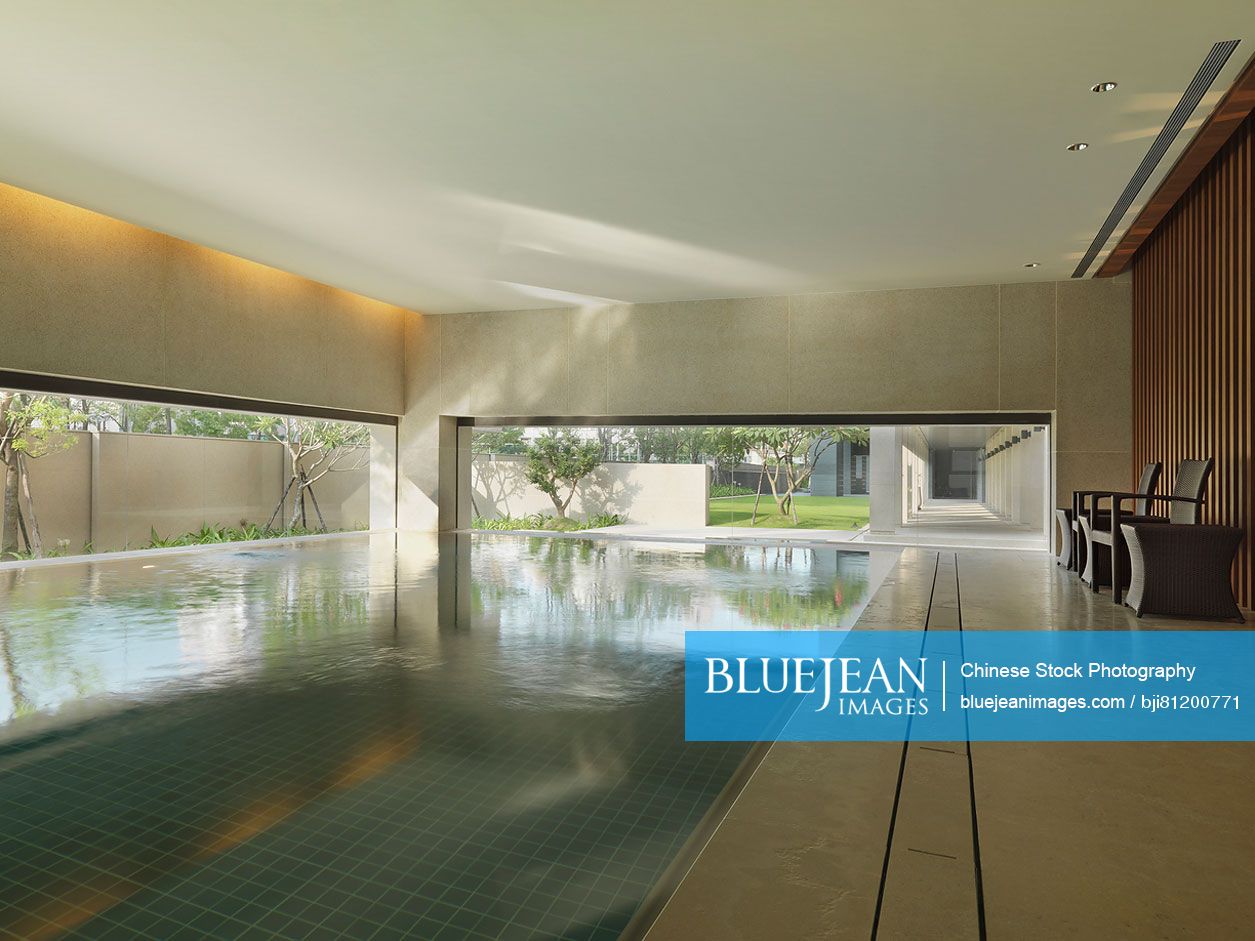 Indoor swimming pool with large windows-High-res stock photo for download