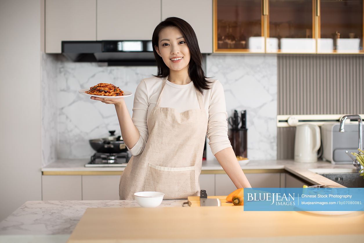 Young Chinese Woman Cooking In The Kitchen-High-res stock photo for ...