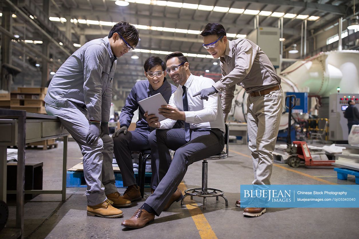 Businessman and engineers talking in the factory-High-res stock photo ...
