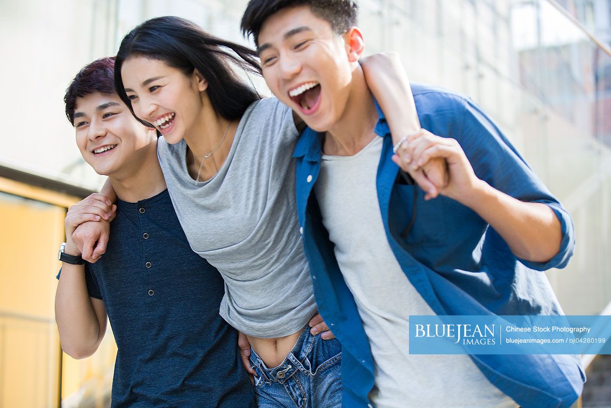 Young Chinese friends playing together-High-res stock photo for download