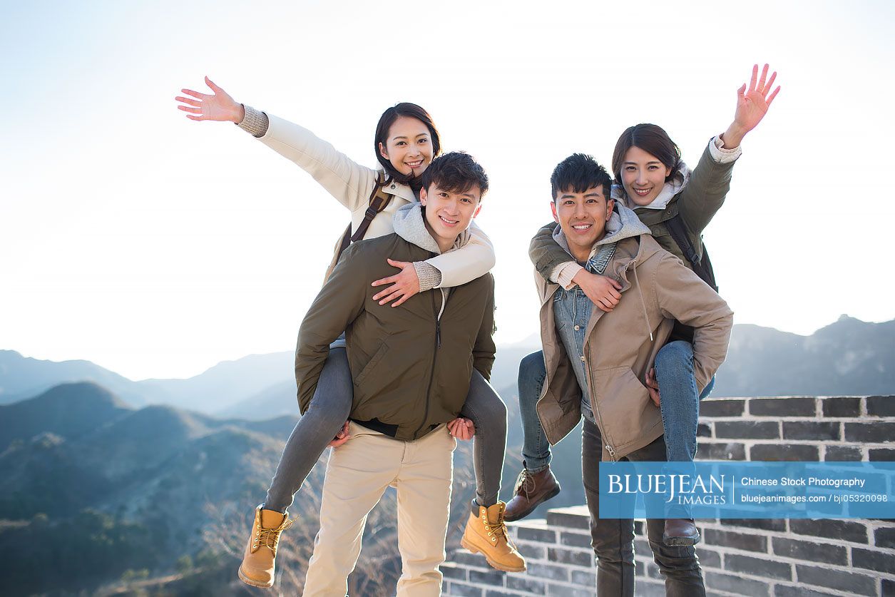 Portrait of happy young Chinese friends on the Great Wall-High-res ...