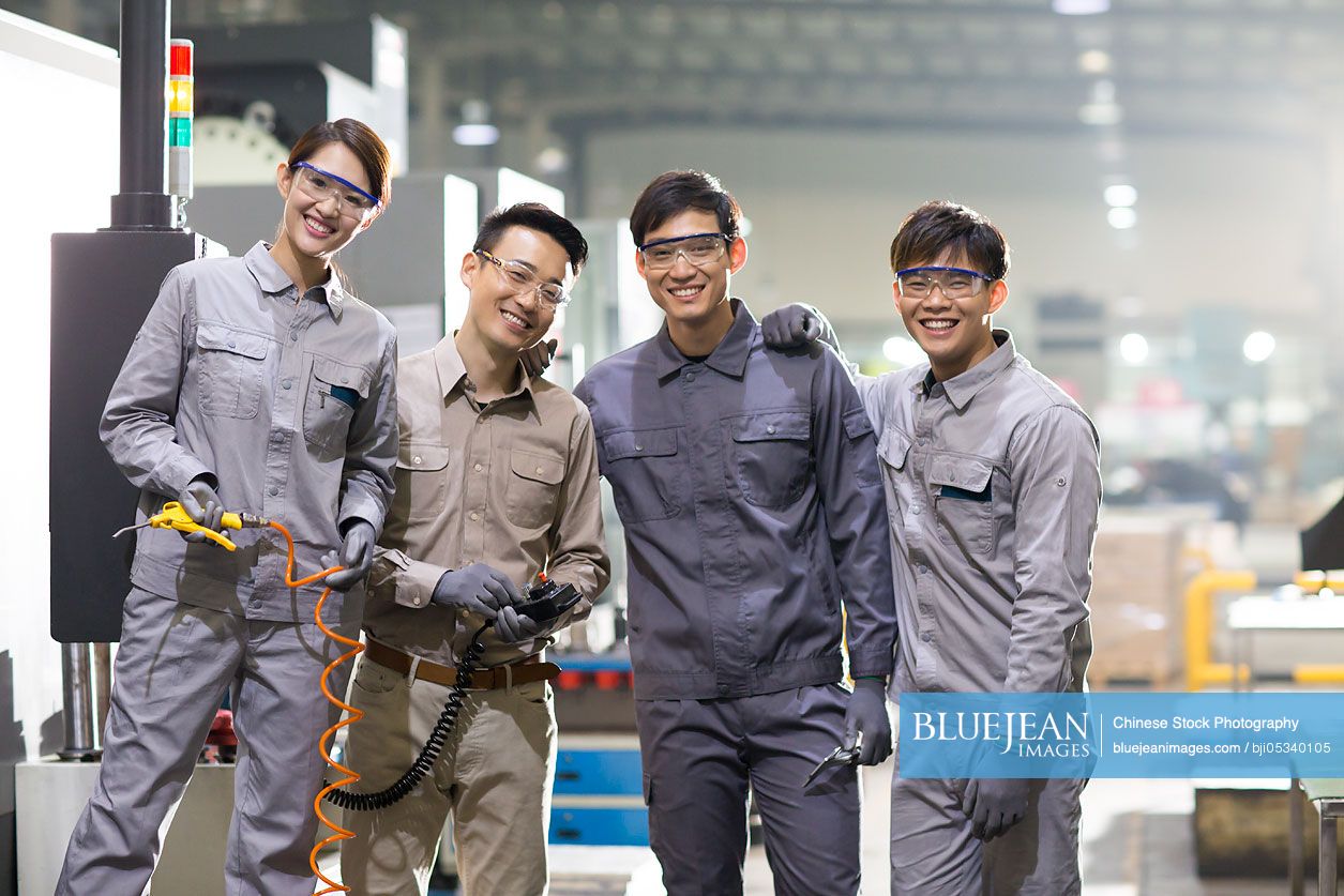 Confident Chinese engineering team in the factory-High-res stock photo ...