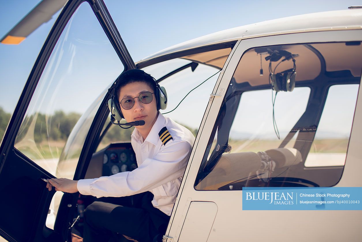 Chinese pilot sitting in helicopter cockpit-High-res stock photo for ...