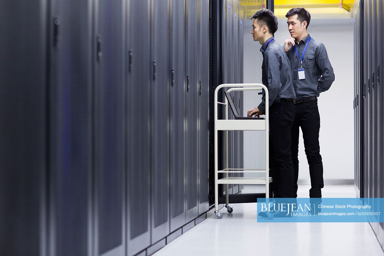 Technicians doing maintenance in computer room-High-res stock photo for ...