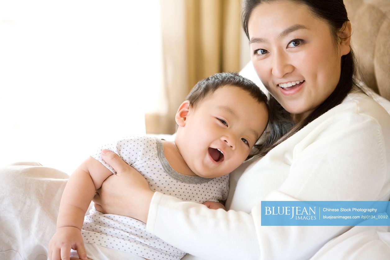 Chinese woman with infant-High-res stock photo for download