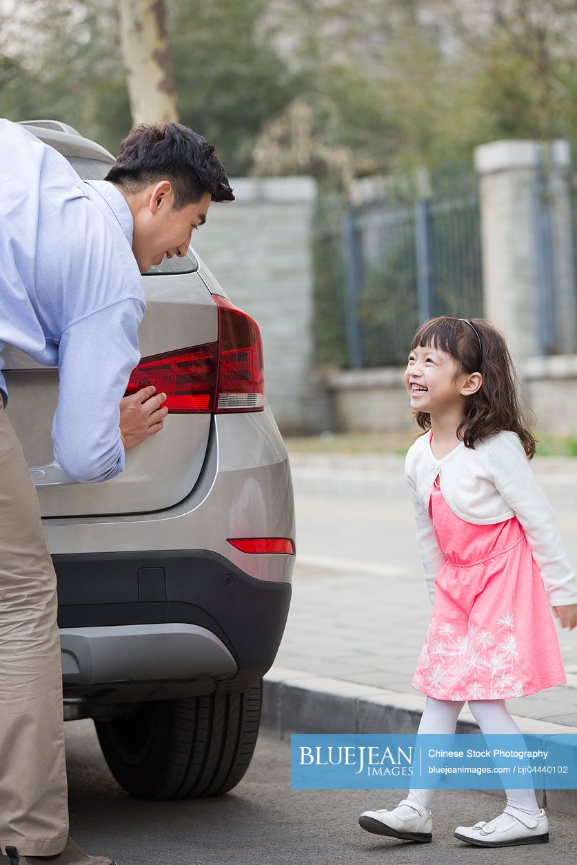 Happy Chinese father and daughter playing hide and seek-High-res stock ...