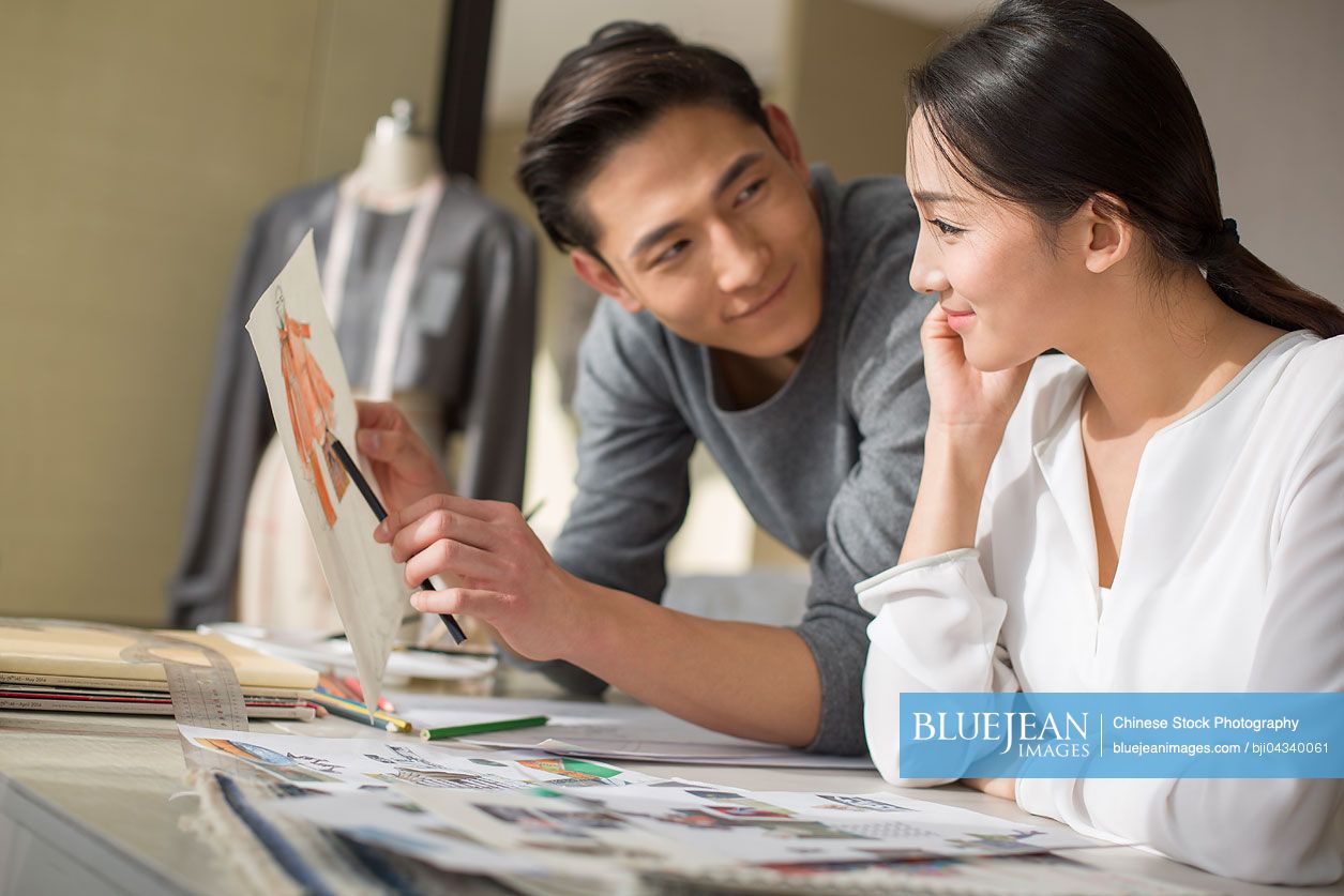 Two Chinese fashion designers drawing sketch-High-res stock photo for download