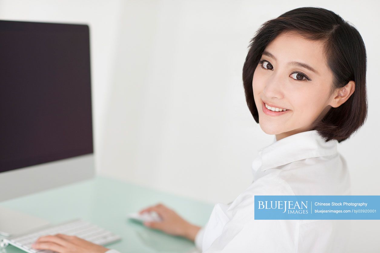 Young Chinese office lady at work-High-res stock photo for download