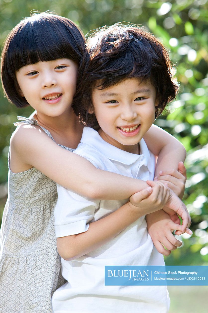 Cute Chinese children having fun in garden-High-res stock photo for ...