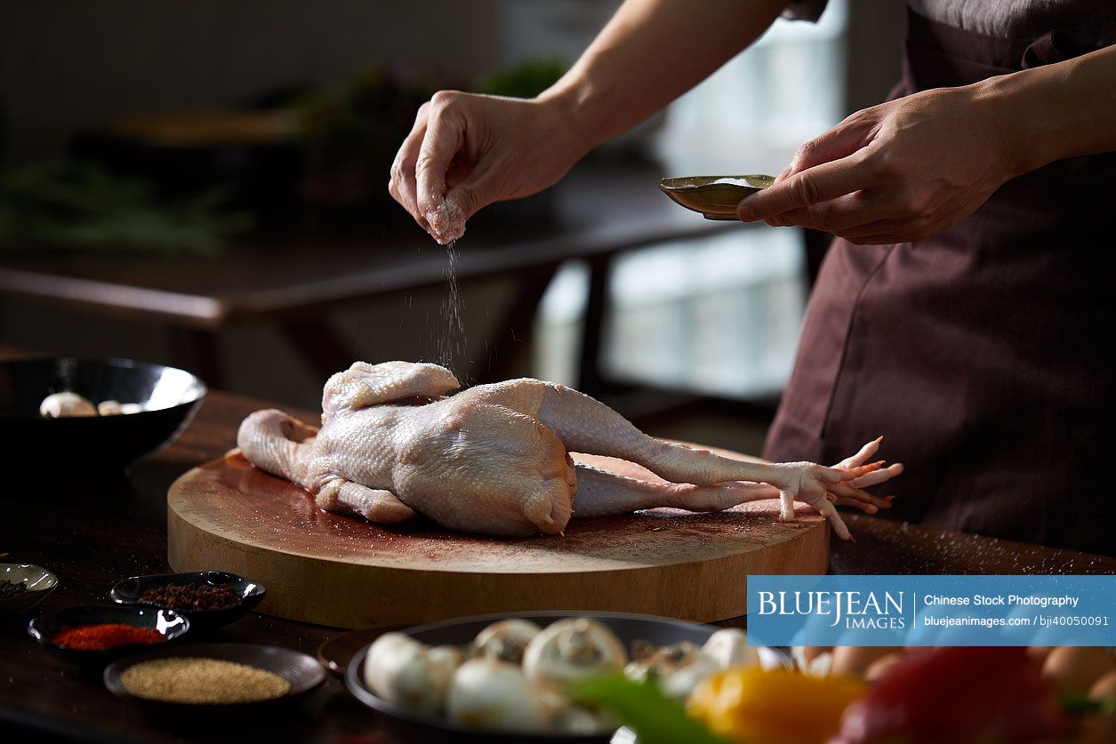 Chinese cook making dishes in the kitchen-High-res stock photo for download
