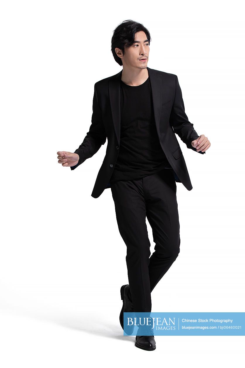 Fashionable mid adult Chinese man dancing-High-res stock photo for download