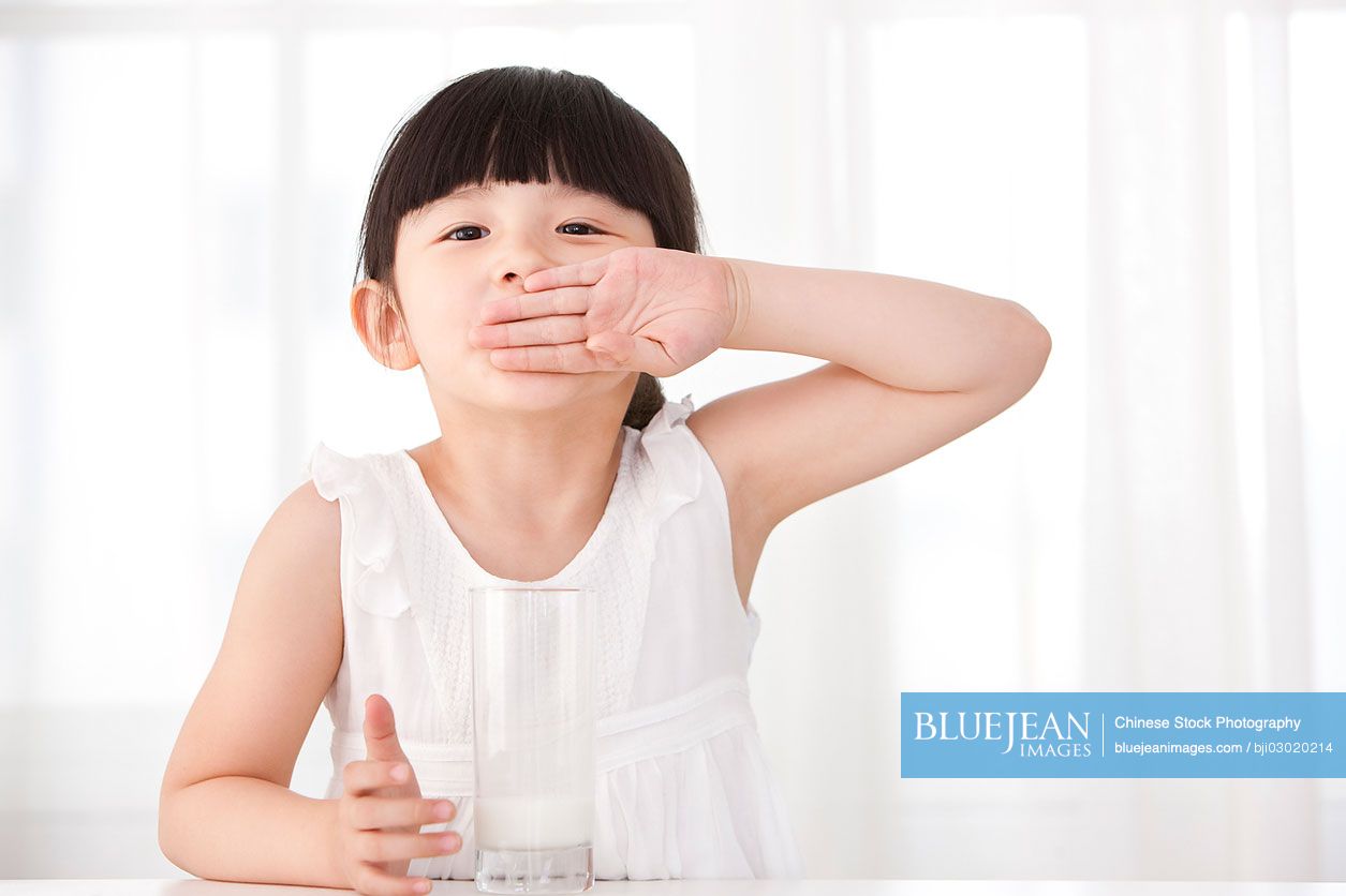Cute Chinese girl and milk-High-res stock photo for download