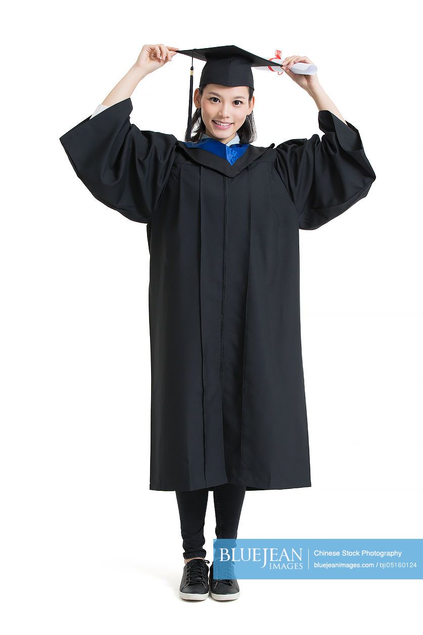 Happy college graduate in graduation gown-High-res stock photo for download