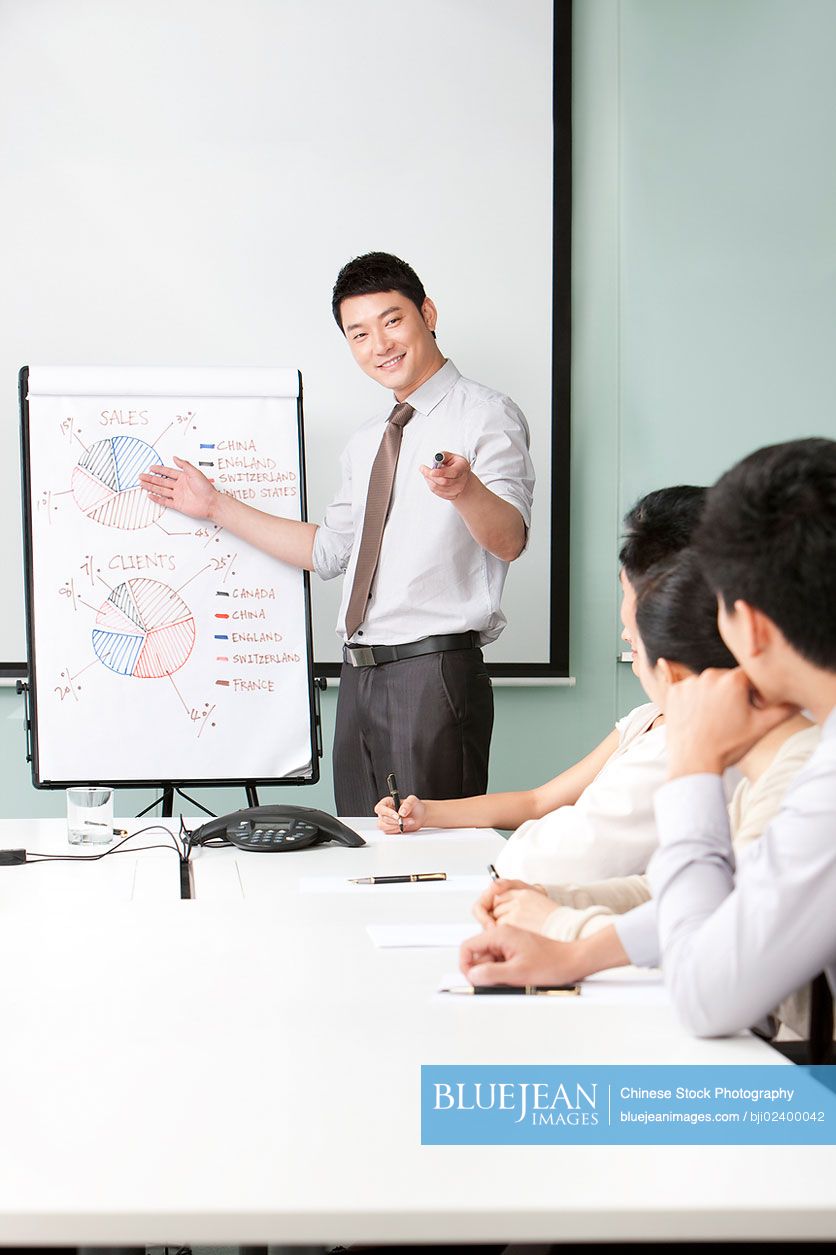 Chinese business executive presenting to business team-High-res stock ...