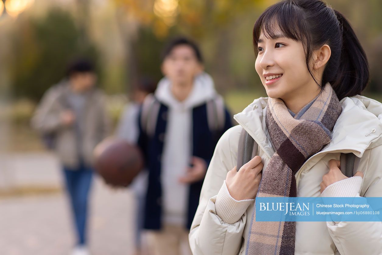 Happy Chinese college student walking on campus-High-res stock photo ...