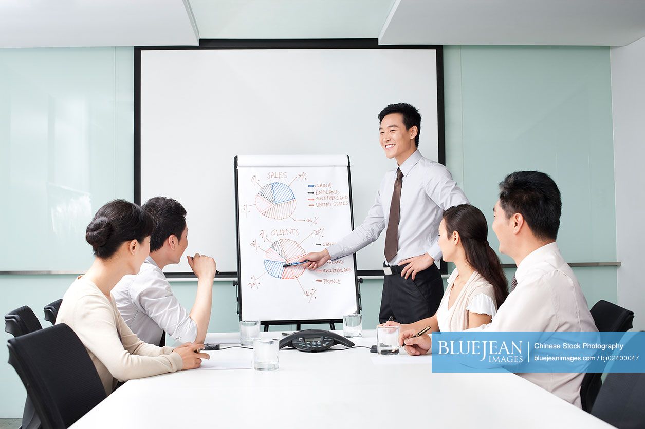 Chinese business executive presenting to business team-High-res stock ...