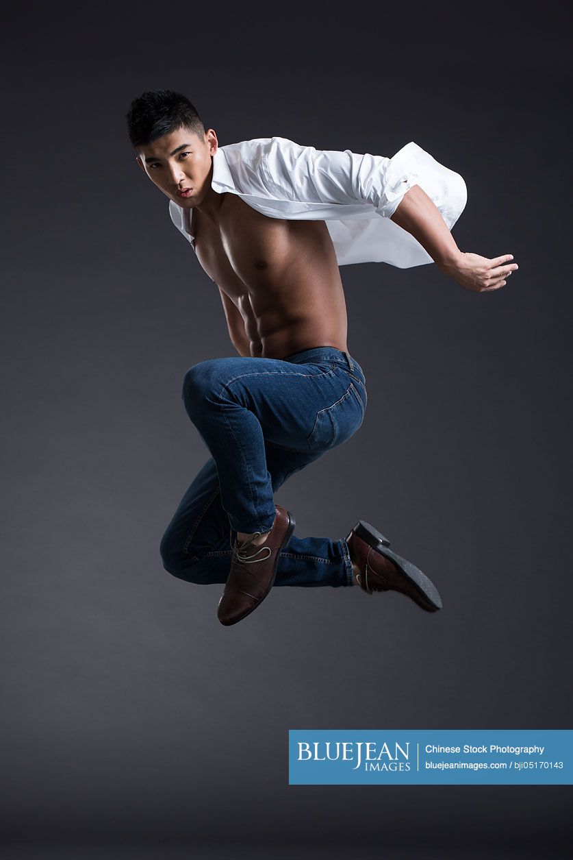 Young Chinese muscular man jumping-High-res stock photo for download
