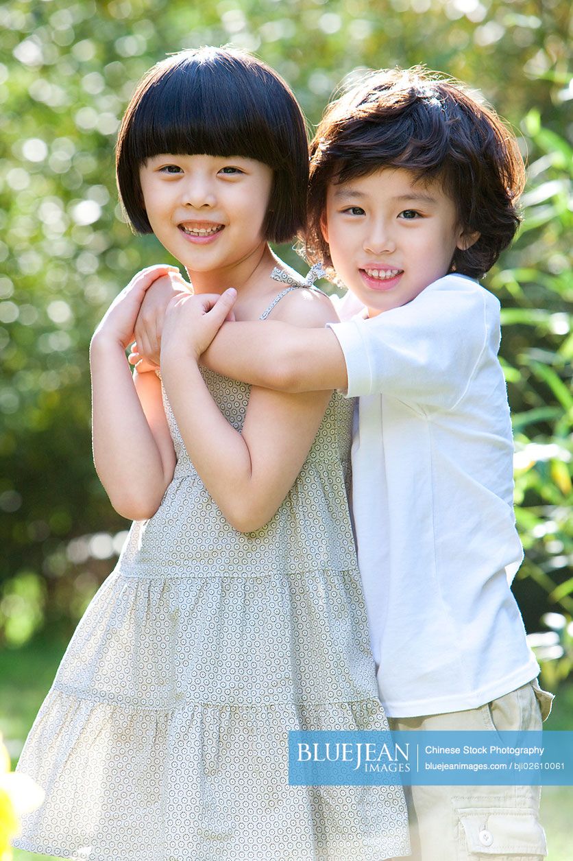 Cute Chinese children having fun in garden-High-res stock photo for ...
