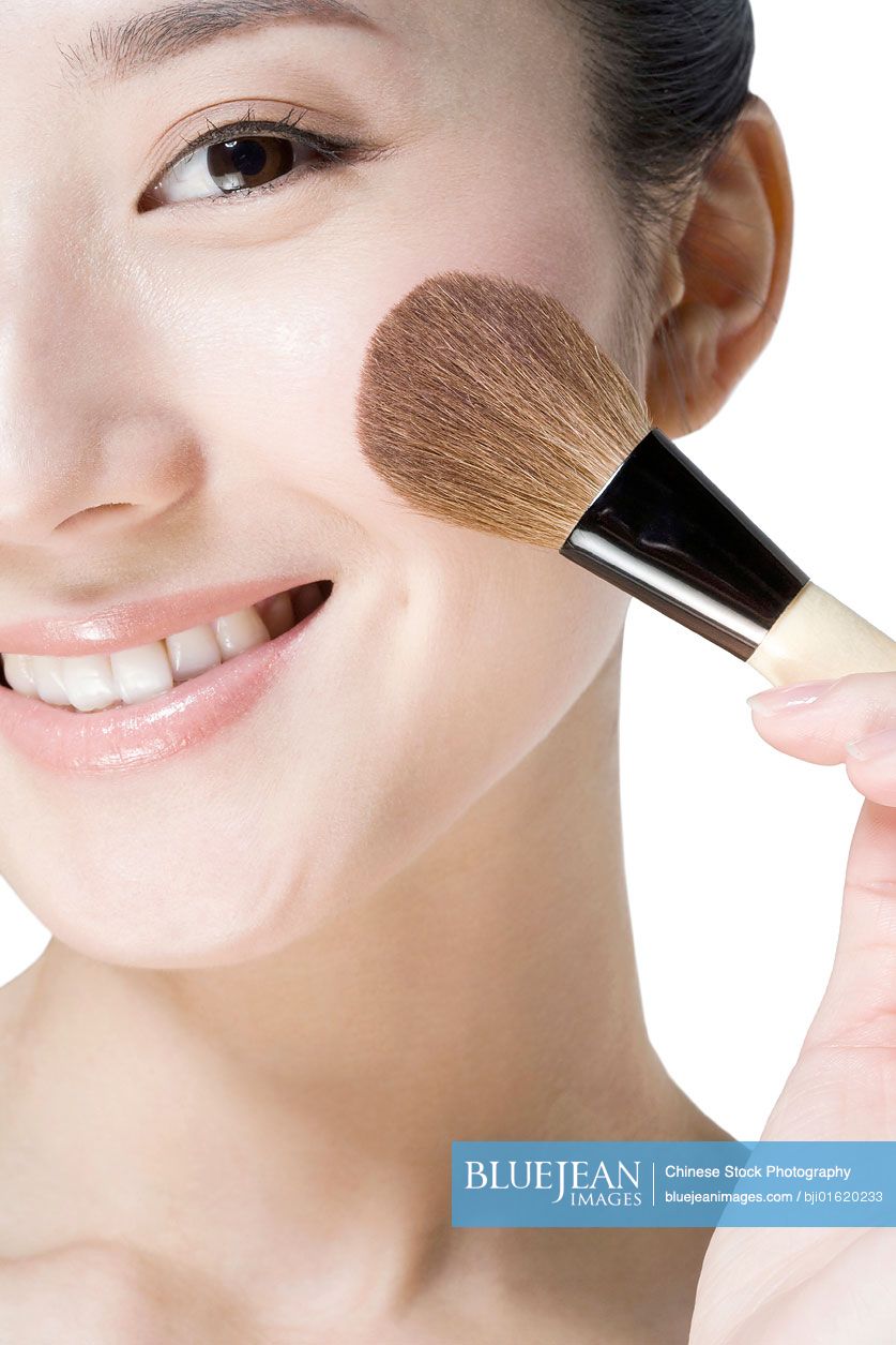 Beauty shot of a young Chinese woman with a blusher-High-res stock photo for download