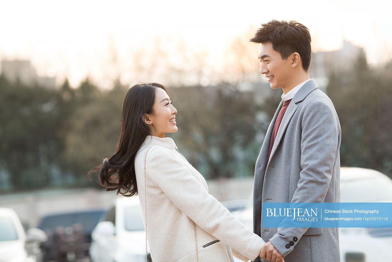 Cheerful young Chinese couple dating-High-res stock photo for download