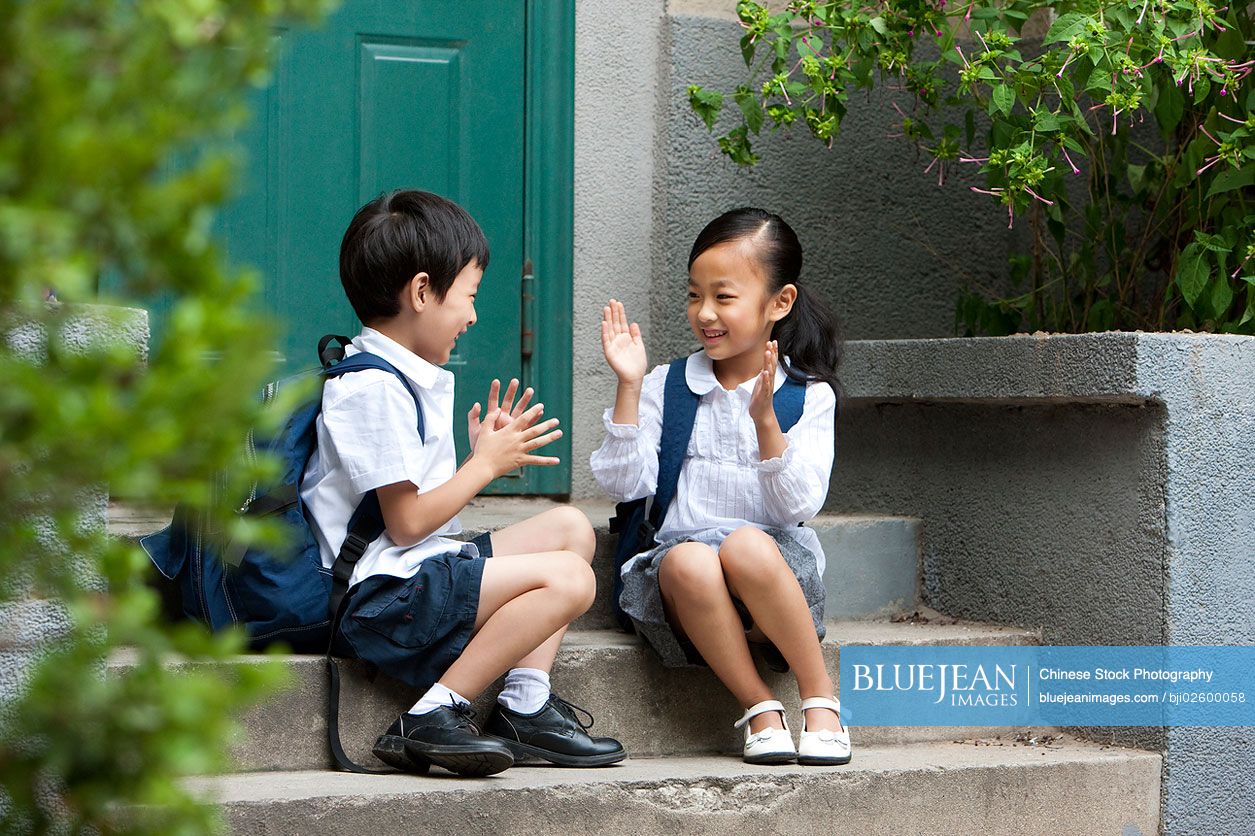 Two Chinese school children playing outside-High-res stock photo for ...