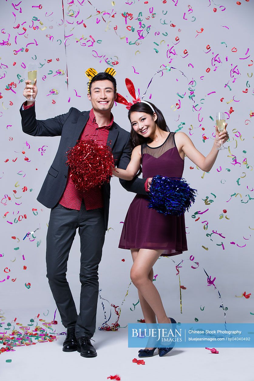 Happy young Chinese couple at a party-High-res stock photo for download