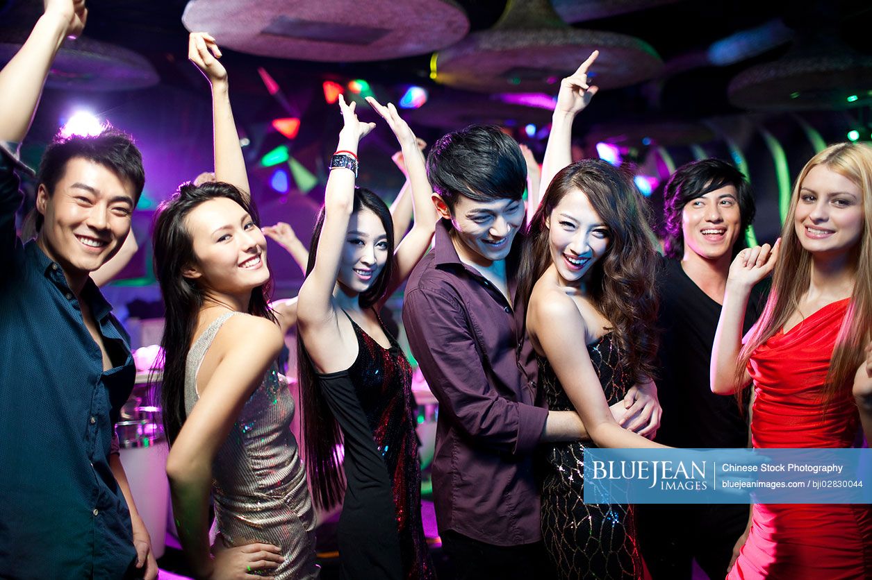 Stylish young Chinese dancing in nightclub-High-res stock photo for ...