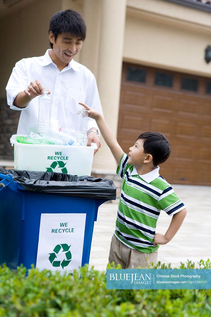 Chinese father and son doing recycling-High-res stock photo for download