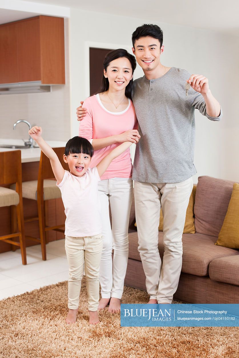 Portrait of Chinese family cheering with key in hand-High-res stock ...