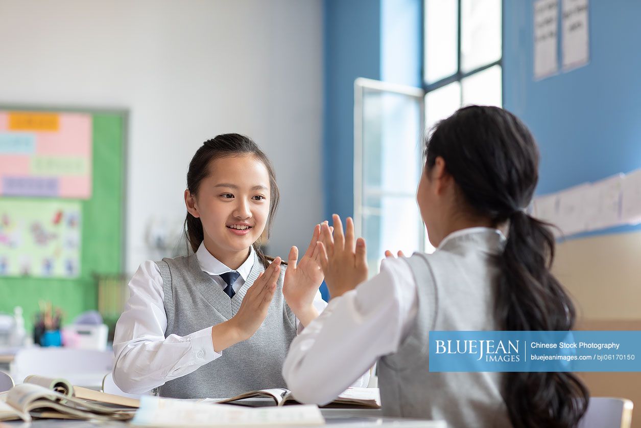 Students having fun in classroom-High-res stock photo for download