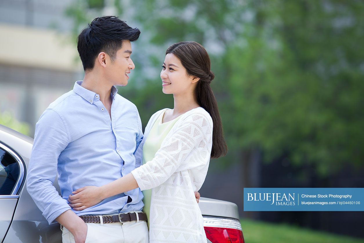 Happy young Chinese couple and car-High-res stock photo for download