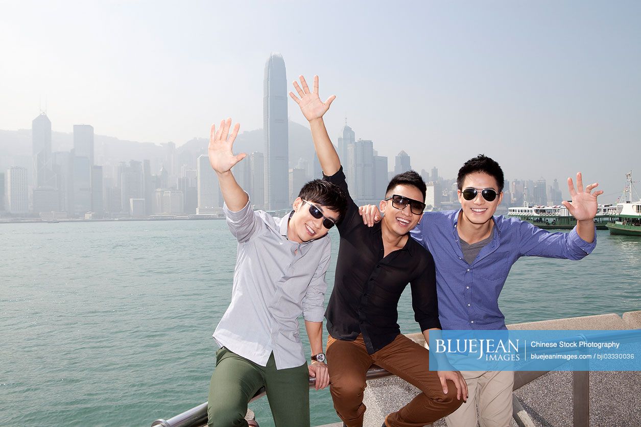 Fashionable young Chinese men enjoying the beautiful moment in Victoria ...