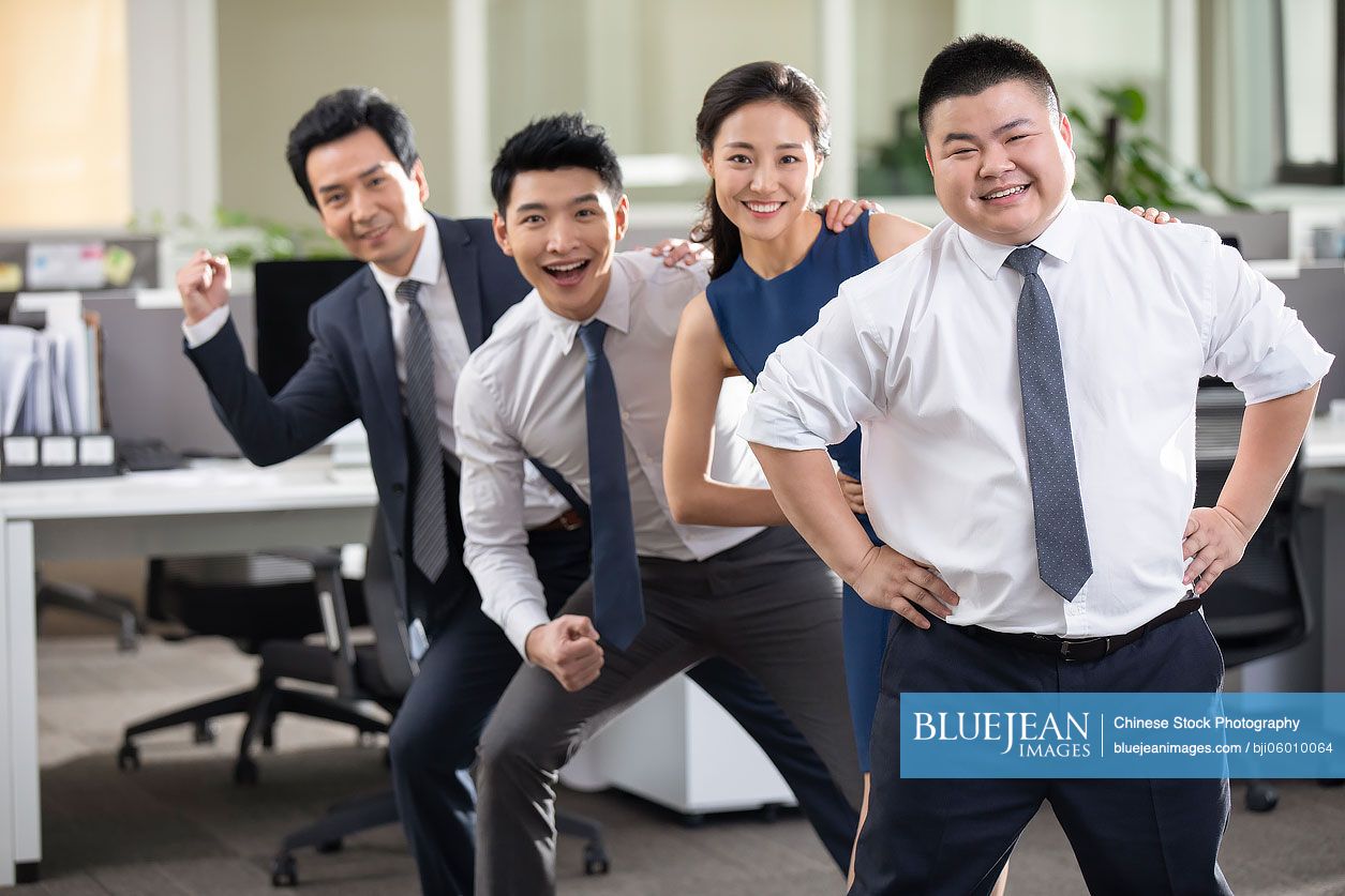 Chinese business team punching the air in office-High-res stock photo ...