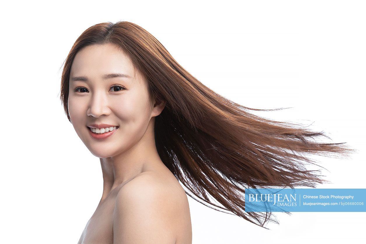 Beautiful young Chinese woman with long hair-High-res stock photo for download