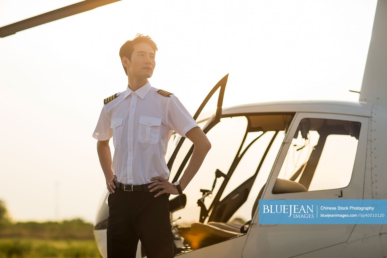 Chinese helicopter pilot standing by the vehicle-High-res stock photo ...
