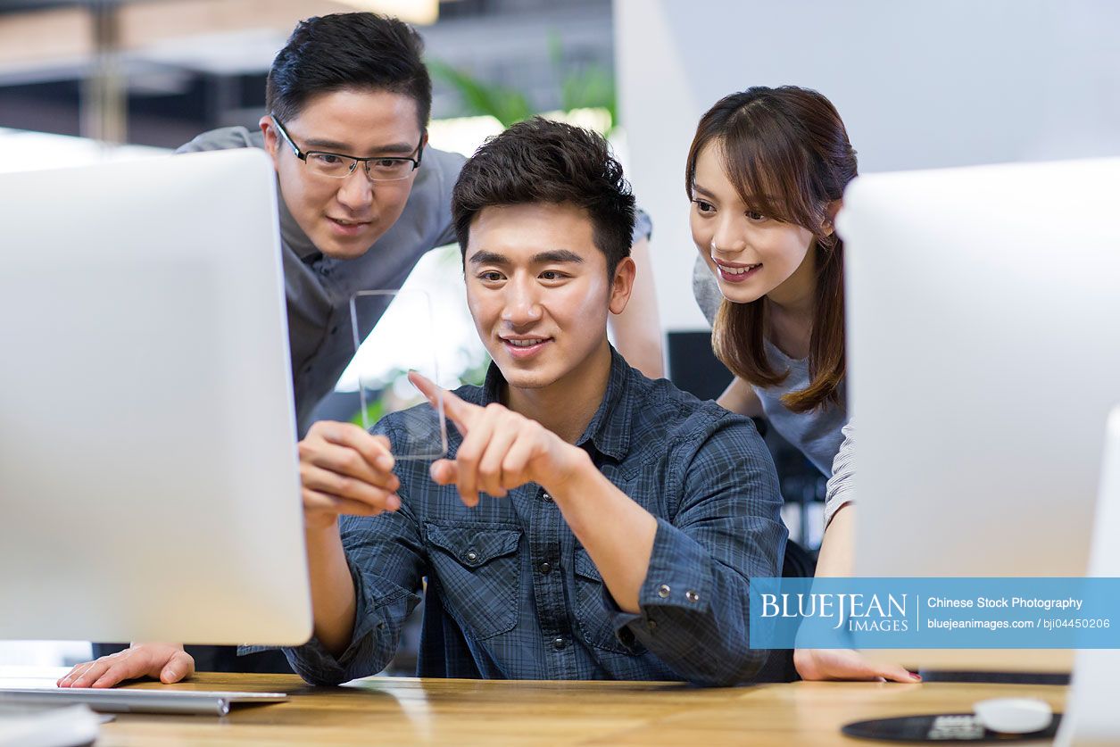 Chinese IT workers developing smart phone-High-res stock photo for download