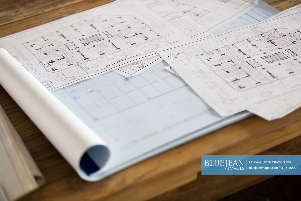 Blueprints on office desk-High-res stock photo for download