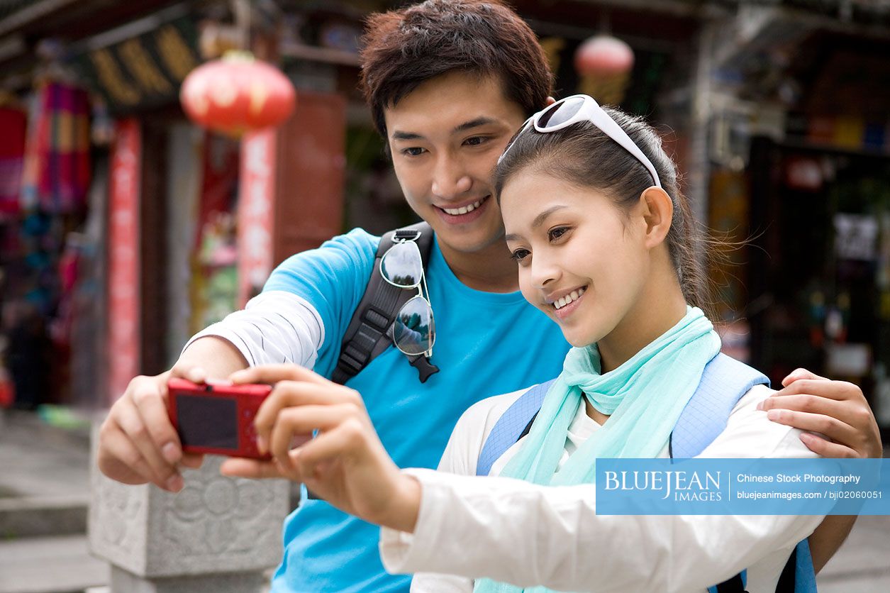 Young Chinese couple taking self-portrait shots in Dali-High-res stock ...