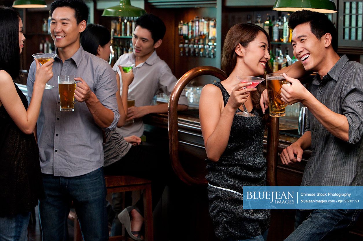 Chinese friends relaxing at a bar-High-res stock photo for download