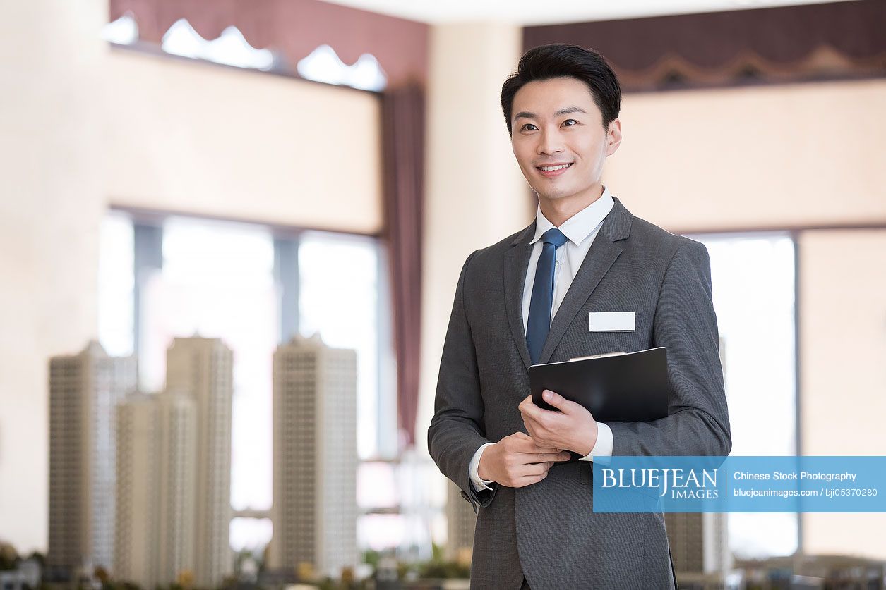 Portrait of confident Chinese male realtor-High-res stock photo for ...