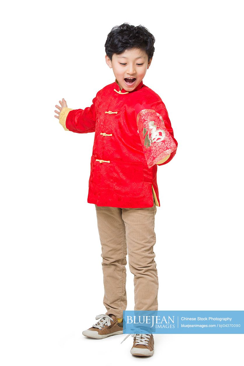 Surprised Chinese boy opening red envelope-High-res stock photo for ...