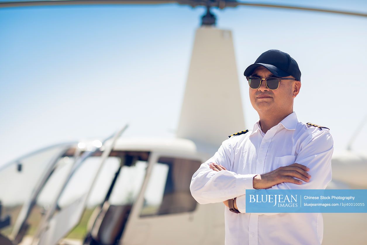 Chinese helicopter pilot standing by the vehicle-High-res stock photo ...