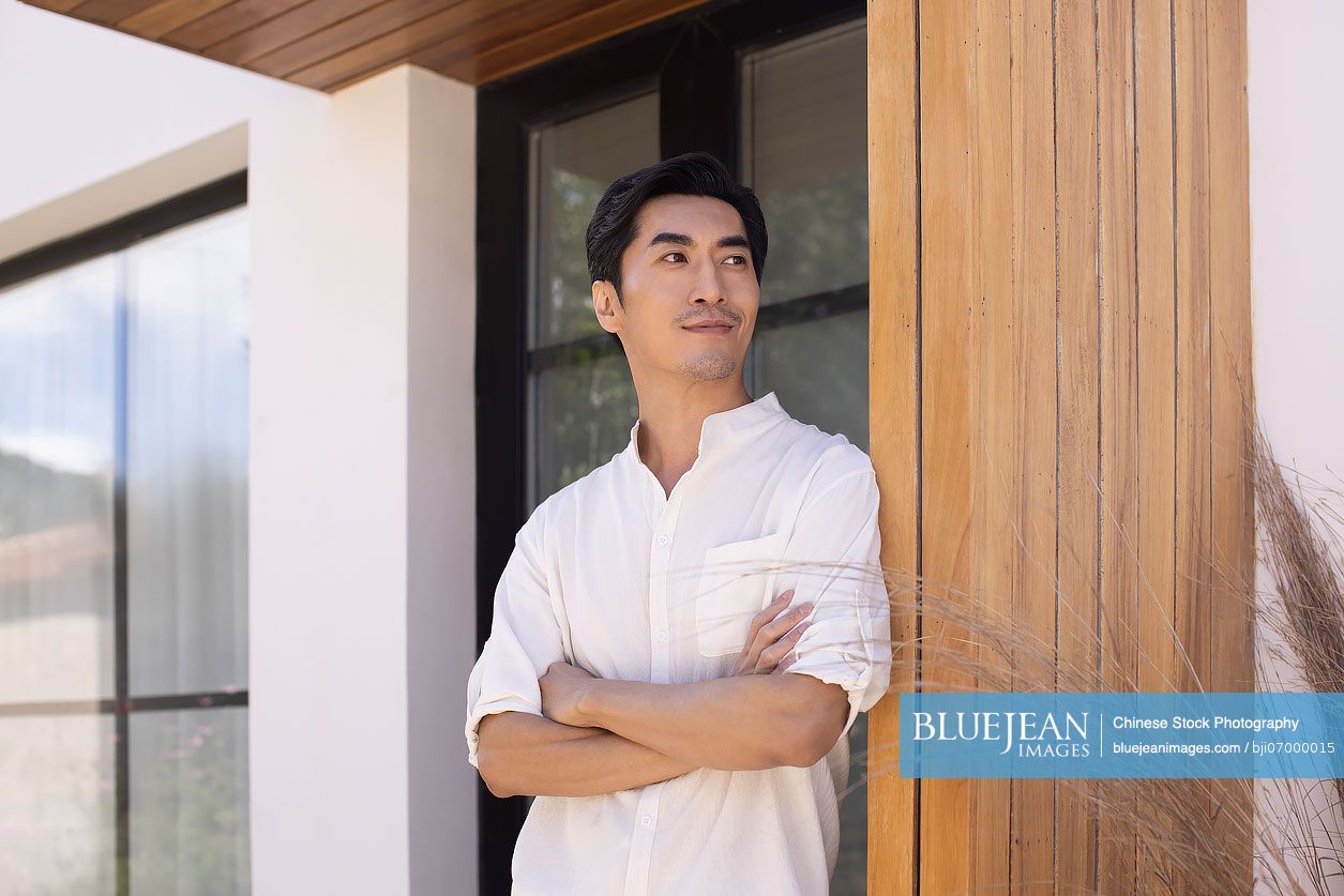 Happy mid adult Chinese man on vacation-High-res stock photo for download