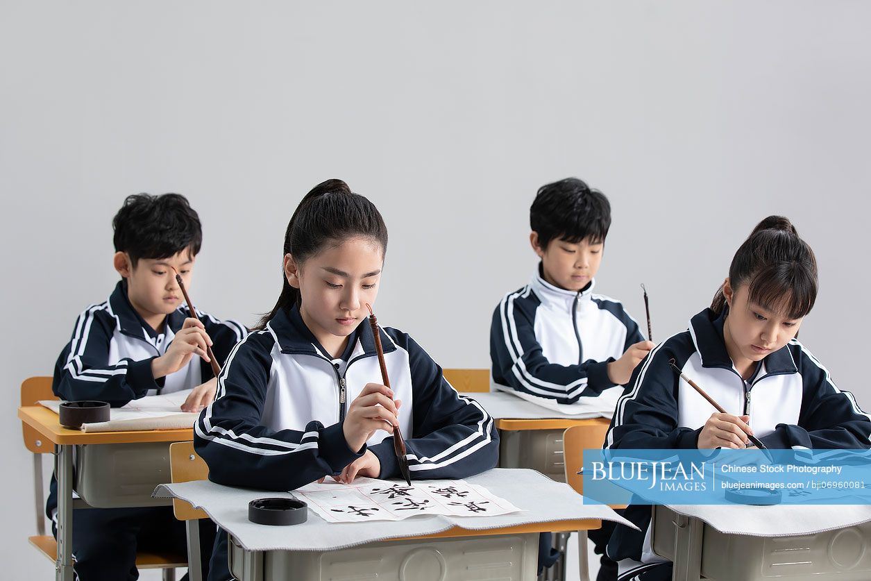 Chinese students practicing calligraphy in classroom-High-res stock ...