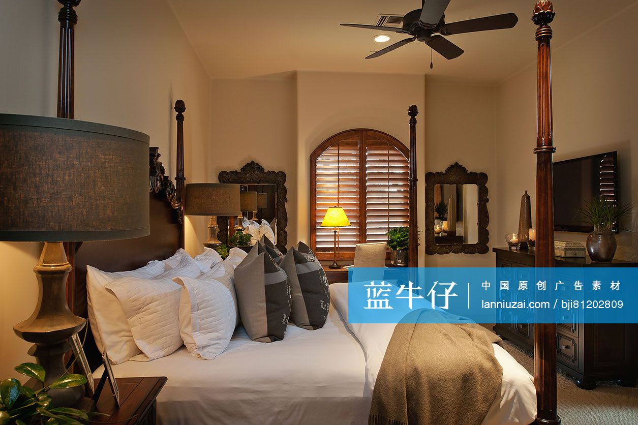 Cozy four post bed with lit lamps in bedroom at house; Scottsdale; USA ...